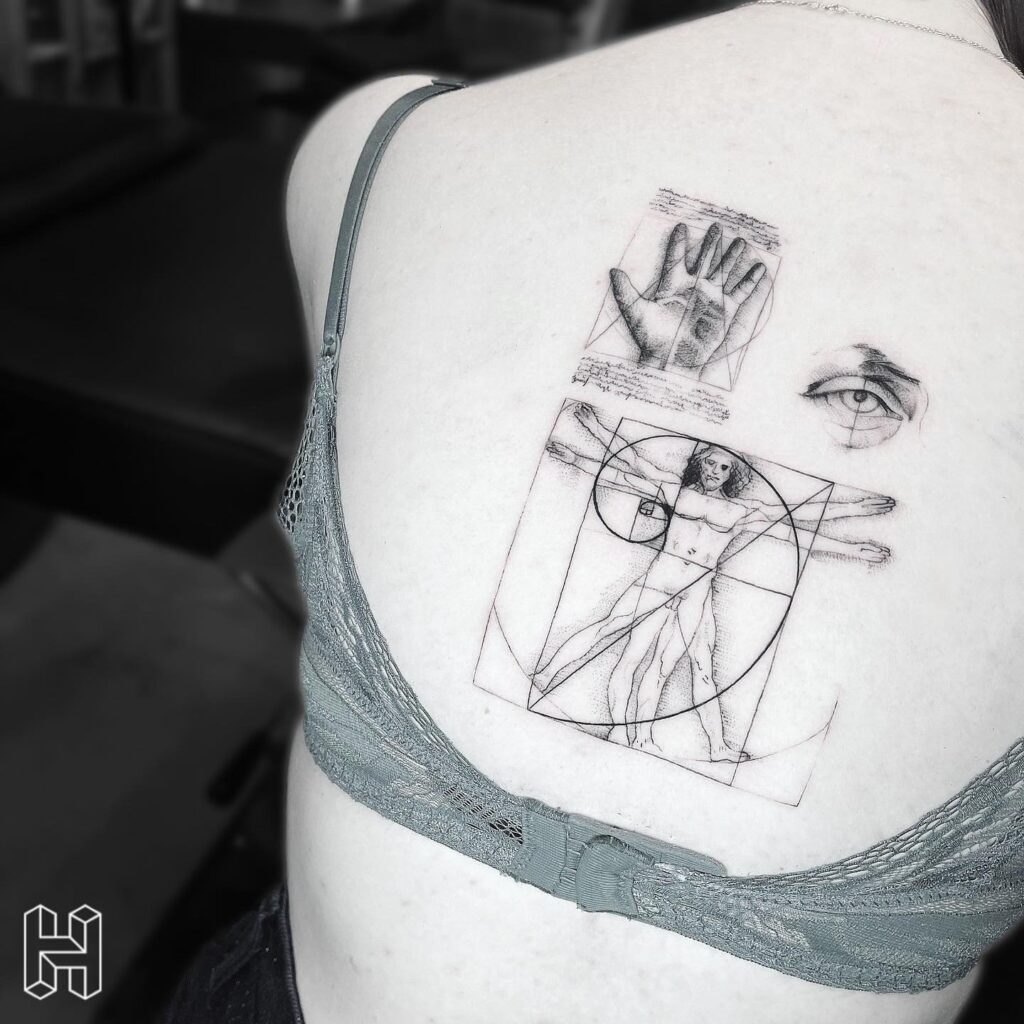 Tetování oko, ruka, postava na zádech | Tetovani.cz